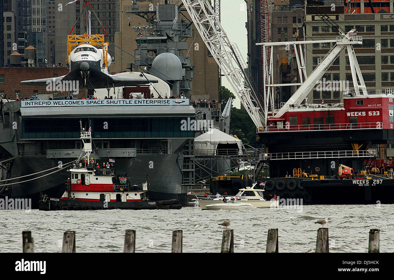 The NASA space shuttle prototype Enterprise is lowered by crane into ...