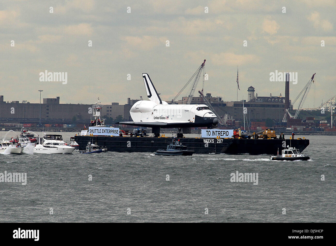 The NASA space shuttle prototype Enterprise is lowered by crane into ...
