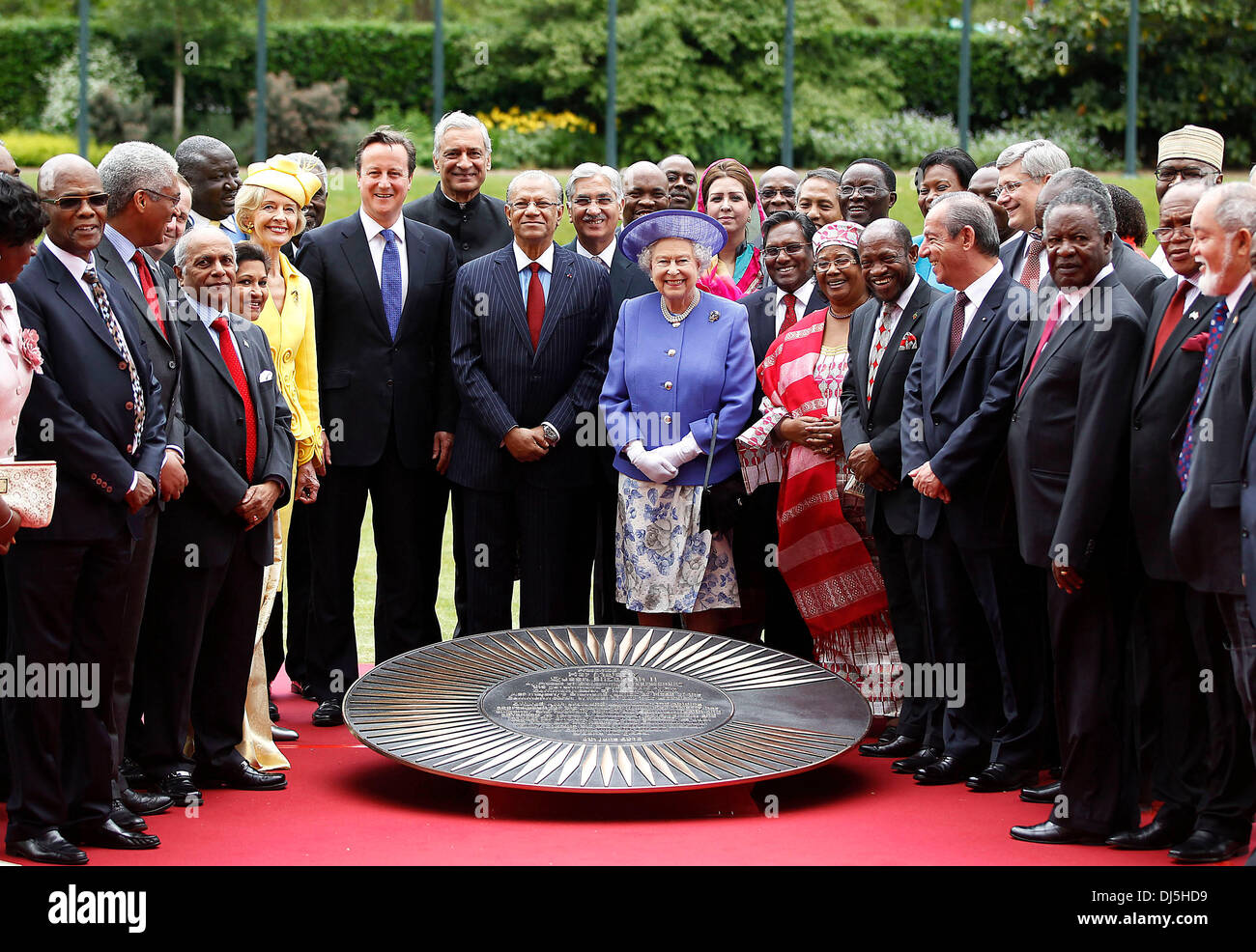Britain's Queen Elizabeth II, center, poses for pictures with ...