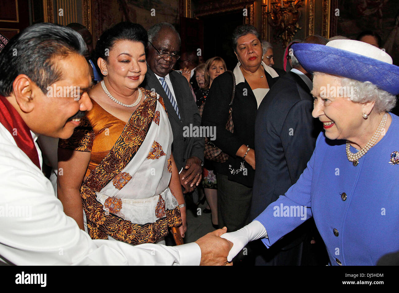 Britain's Queen Elizabeth II , right, shakes hands with Sri Lanka ...