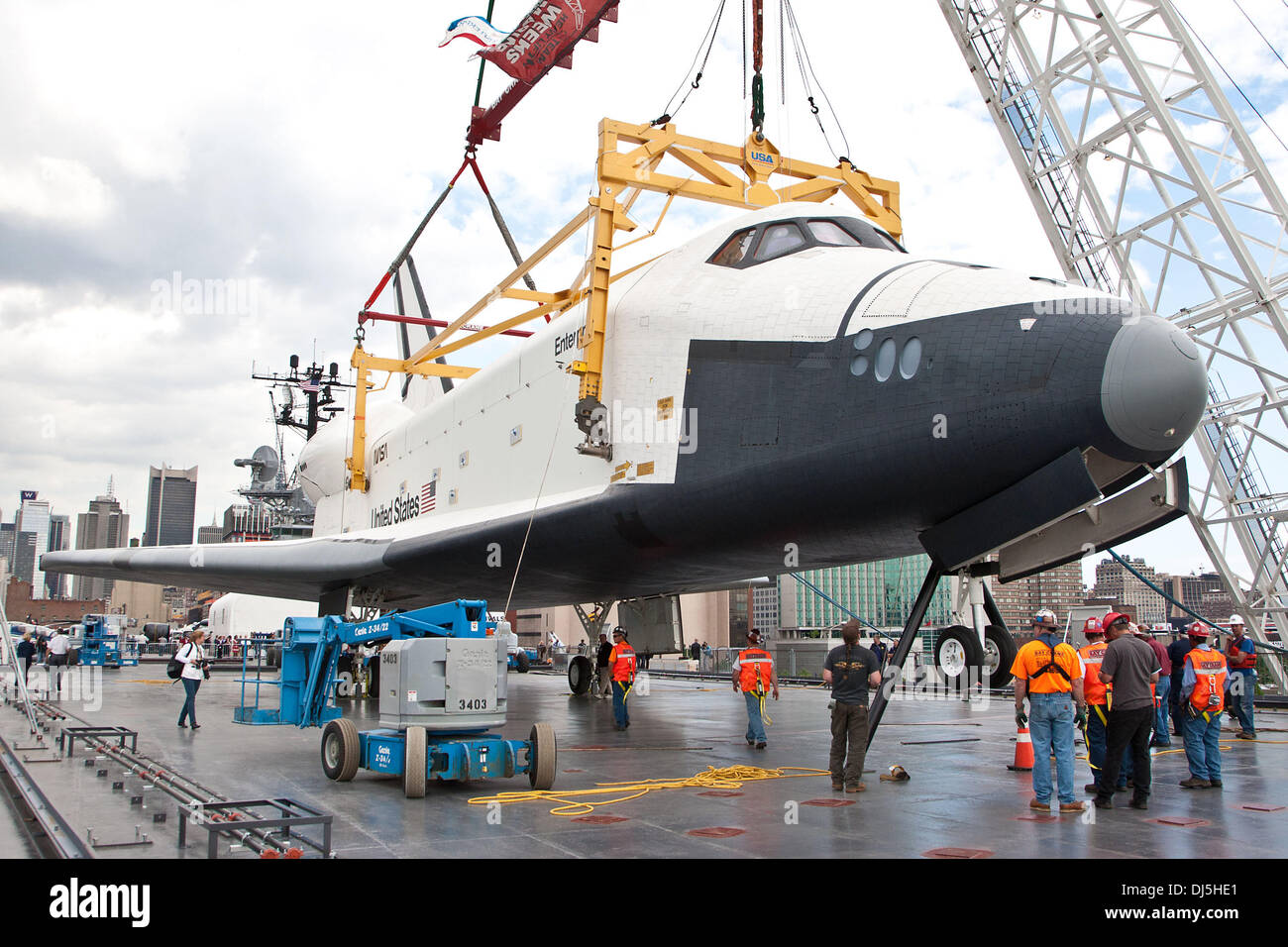 The NASA space shuttle prototype Enterprise is lowered by crane into ...