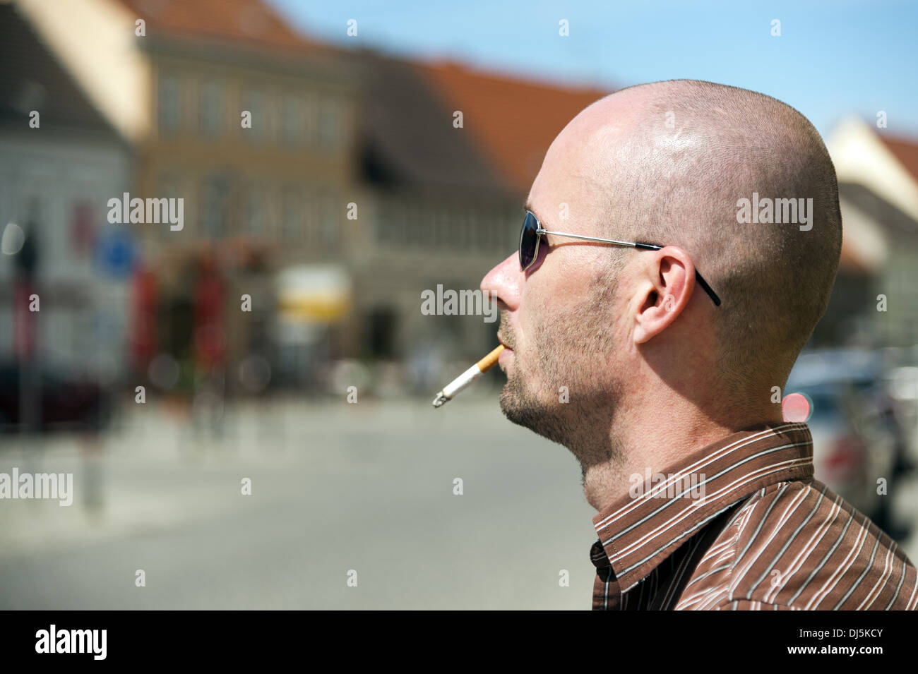 Young man with cigarette Stock Photo - Alamy