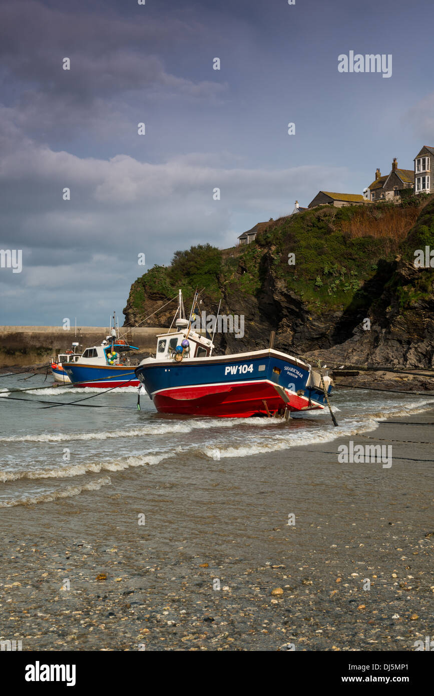 Fishing boats in Port Isaac Cornwall with the tide coming in Stock ...