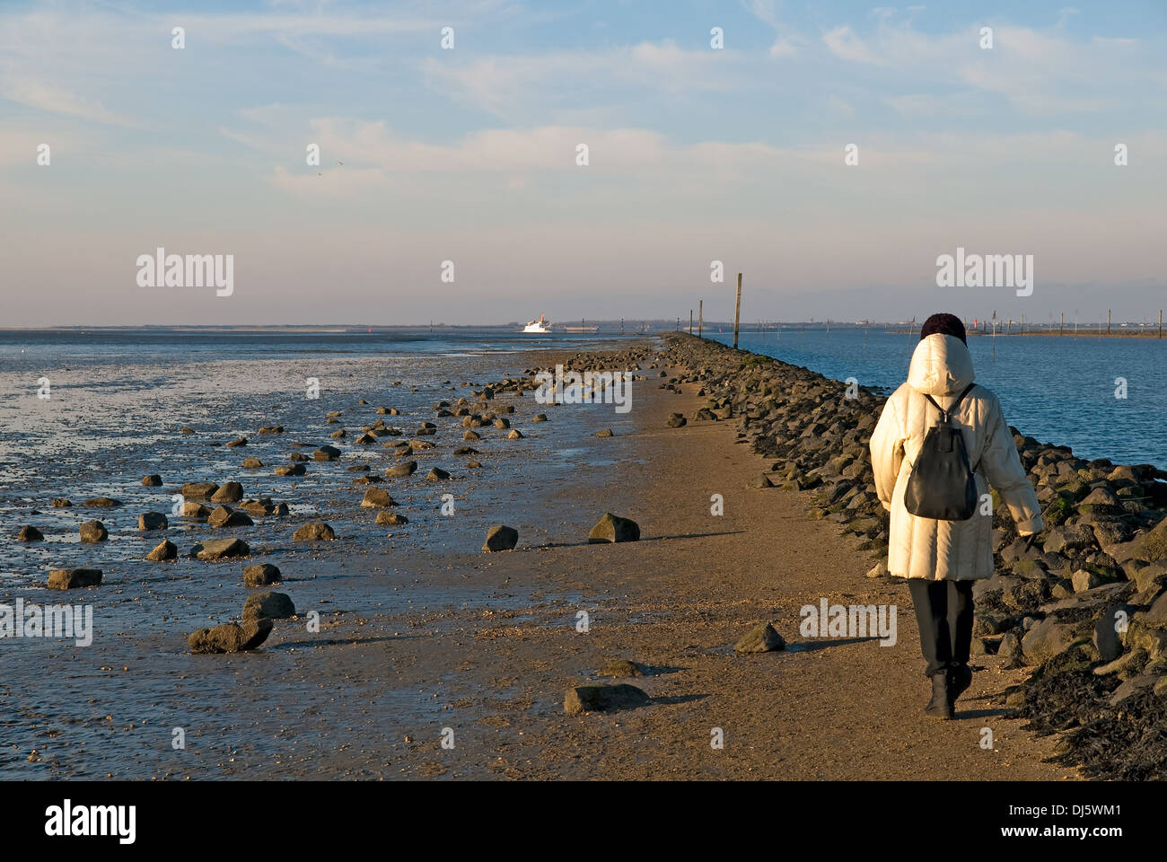 woman walking in tidal flats Stock Photo - Alamy