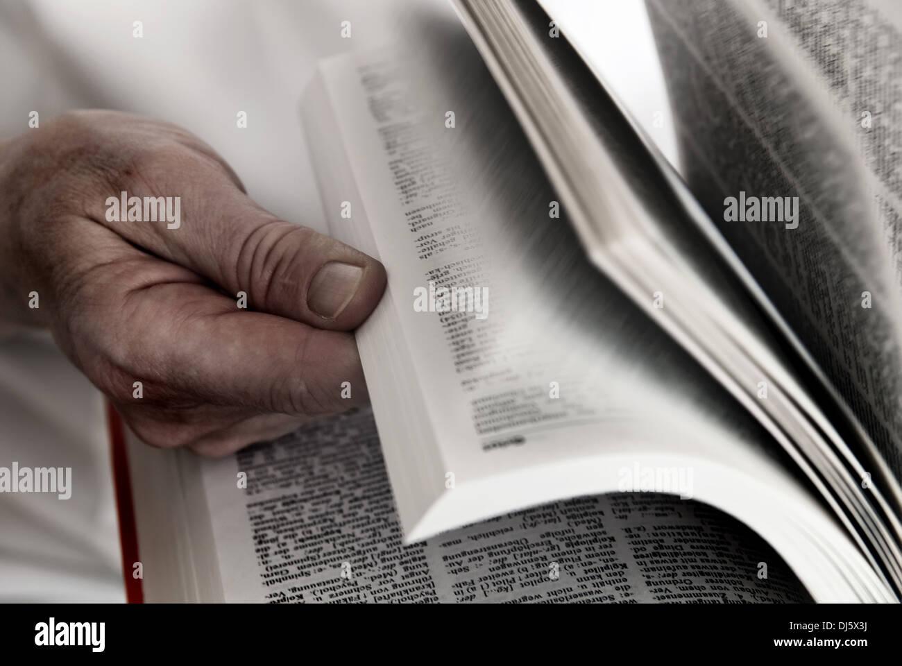 hand and book Stock Photo - Alamy