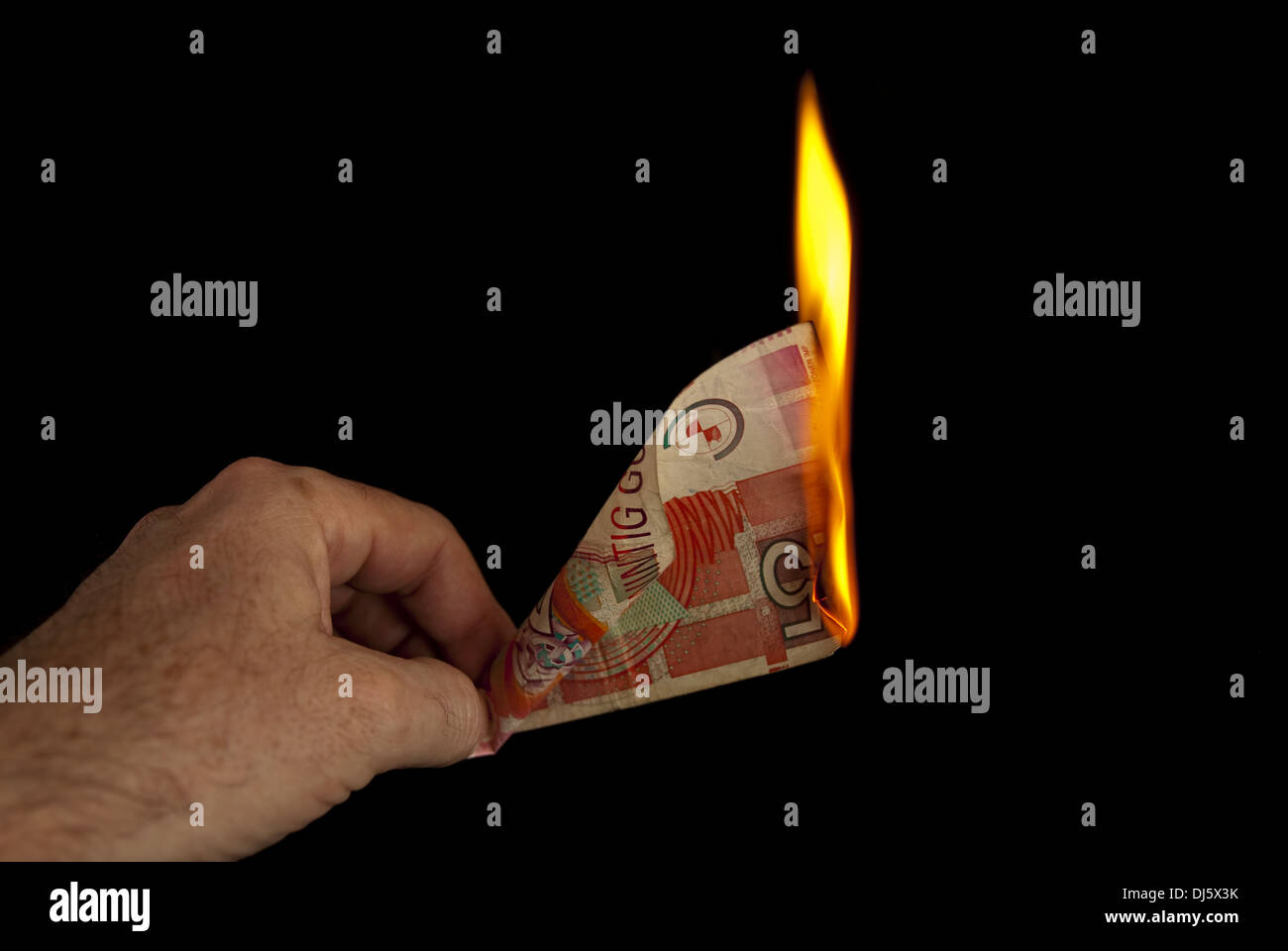 burning the money Stock Photo - Alamy