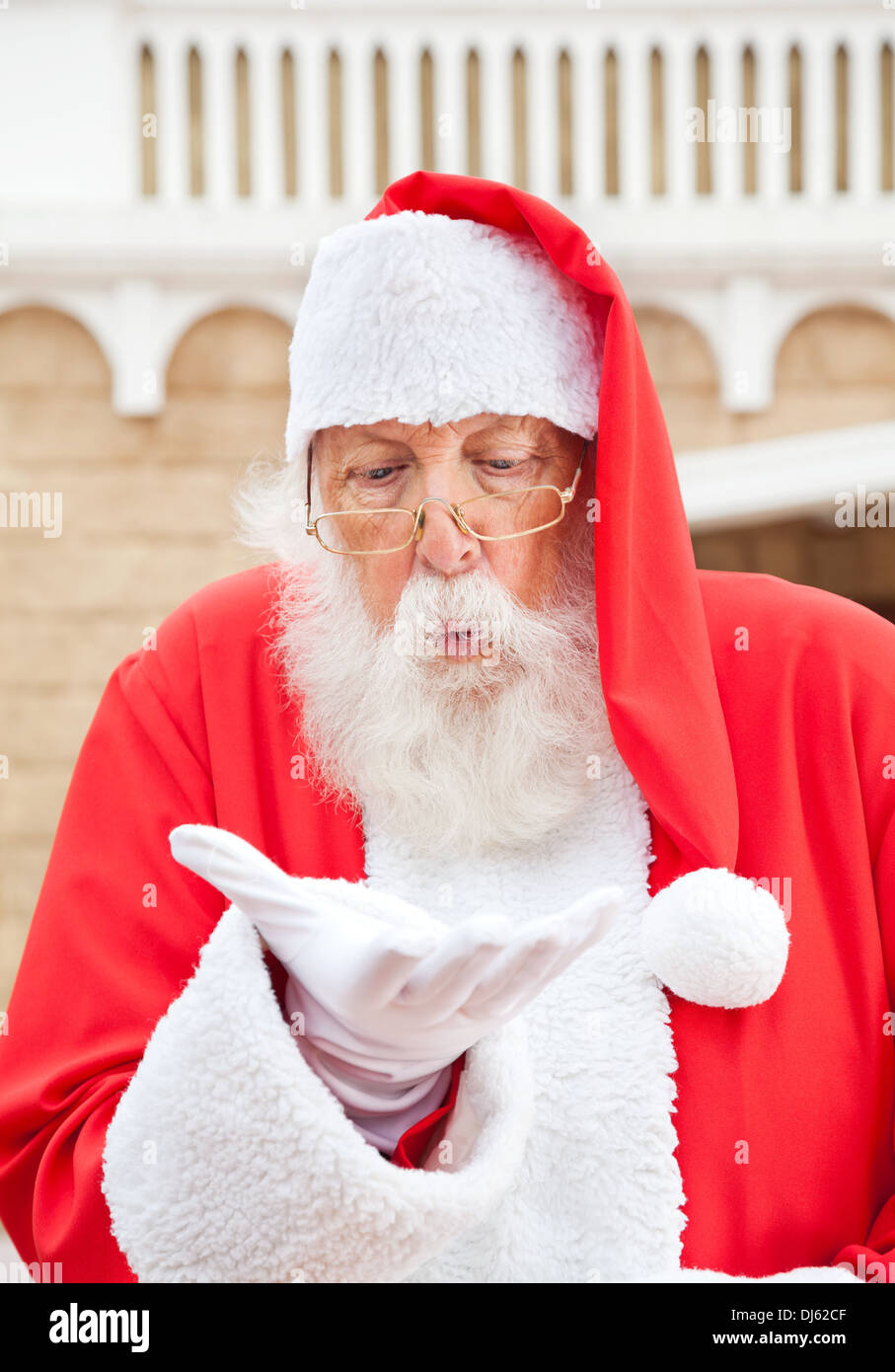 Santa Claus Blowing In Palm Stock Photo - Alamy
