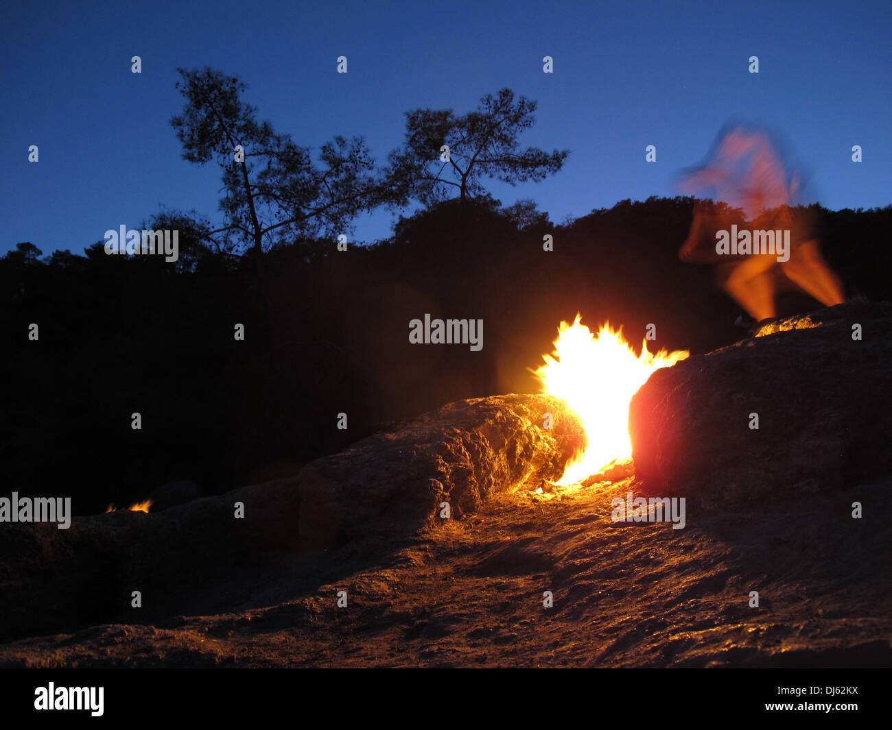 The so called eternal flame flickers between some rocks in the national ...