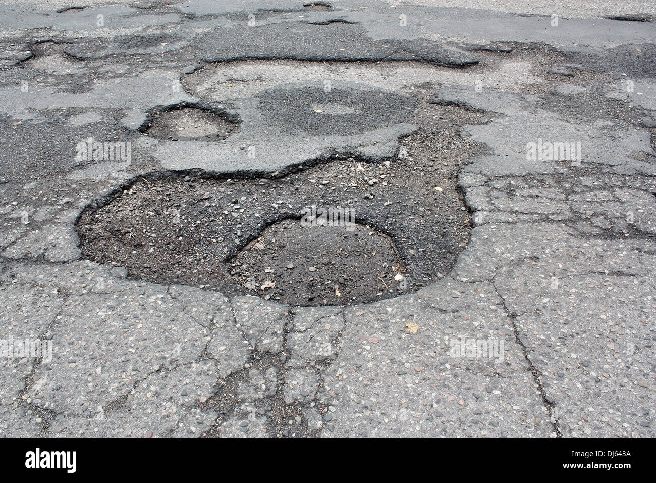A large hole in the pavement asphalt gap Stock Photo - Alamy