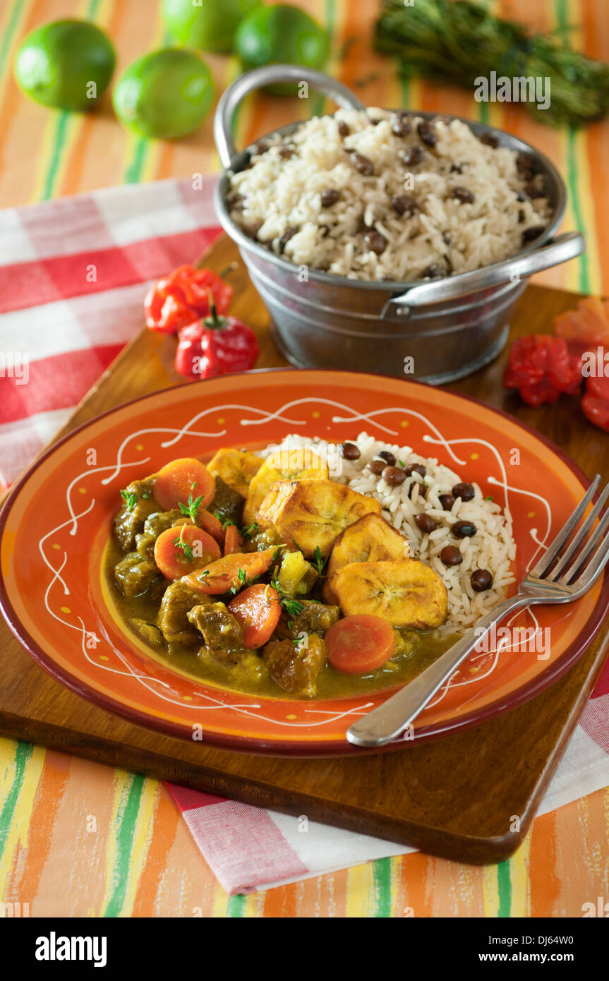Curry goat with rice and gungo peas. Jamaica Food Stock Photo - Alamy