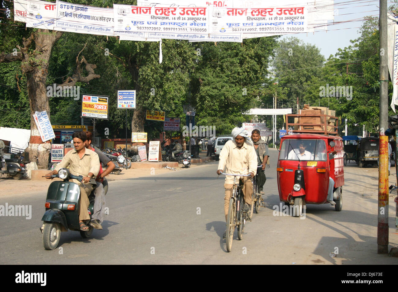 Tuk Tuk and Rickshaws and bike riders on the streets of New Delhi in India Stock Photo - Alamy