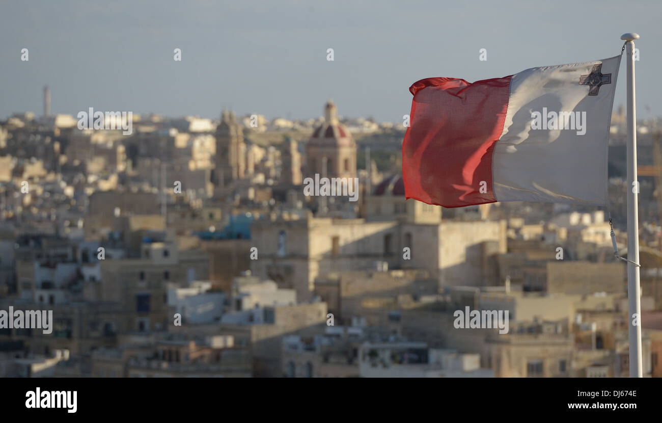 Flag of Malta with George Cross with the old city of Senglea in the ...