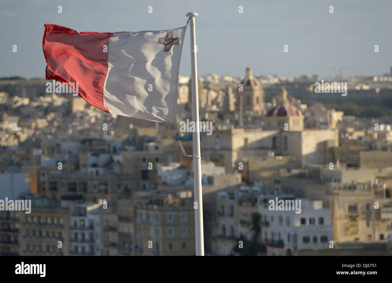 Flag of Malta with George Cross with the old city of Senglea in the ...