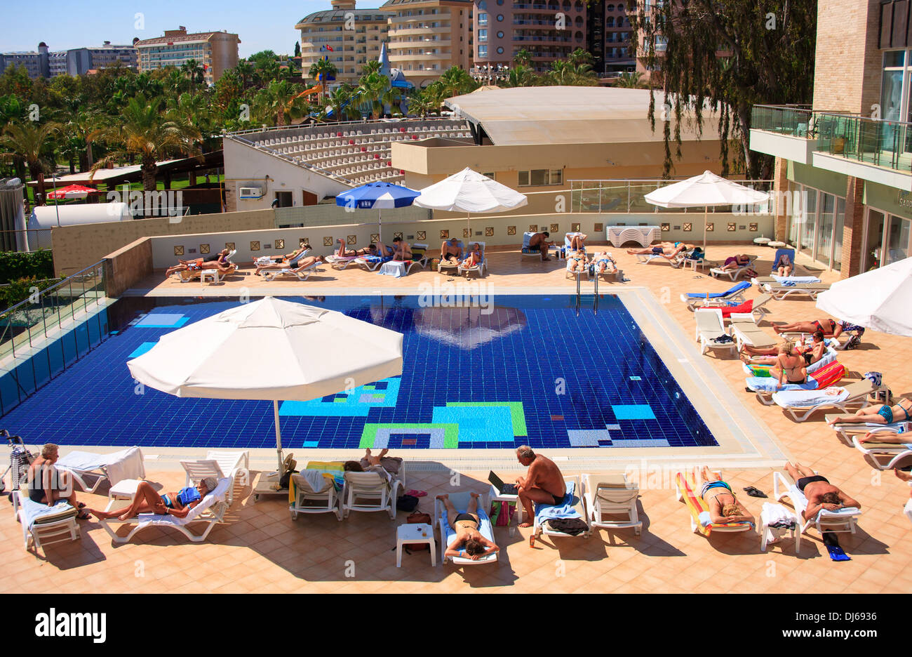 sunbathing by the pool Stock Photo - Alamy