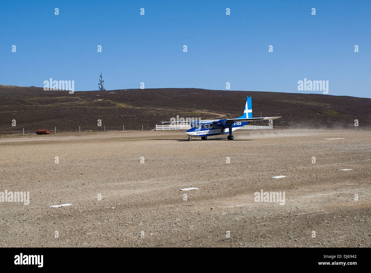Small islander plane coming into land on Fair Isle airstrip Stock Photo ...