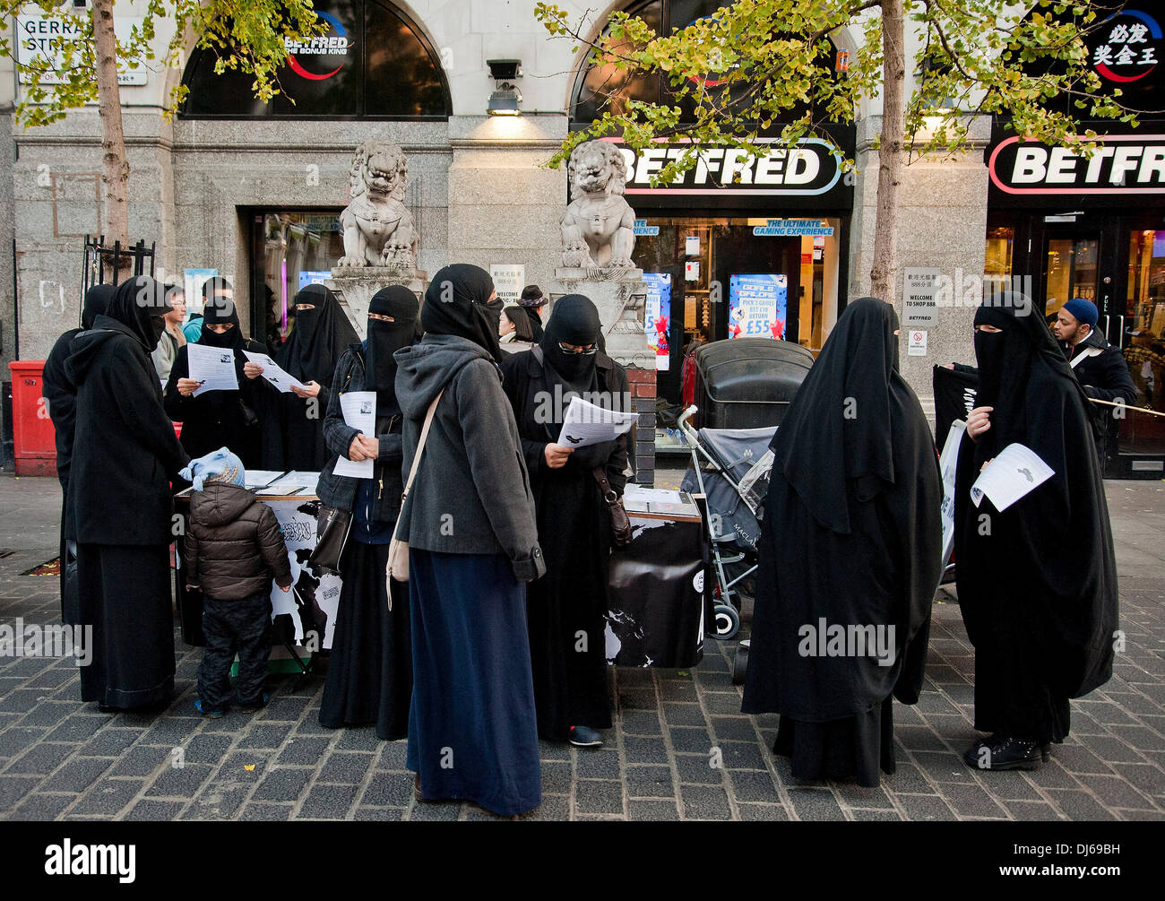 London, UK. 22/11/13. Women wearing Burqas hand out leaflets as Muslims ...