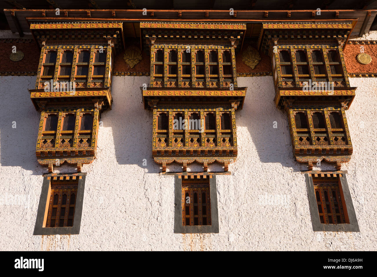 Bhutan, Punakha Dzong, carved wooden windows, with patterned decoration ...