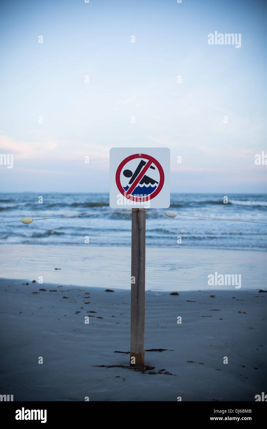 A no swimming sign on a beach at sunset in Galveston, Texas, USA Stock ...