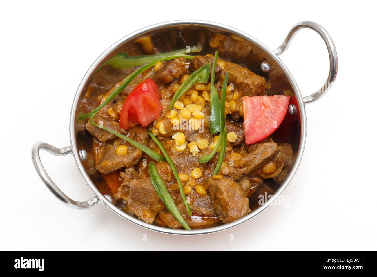 Lahore-style lamb and Chana dhal (split pea) curry, garnished with ...