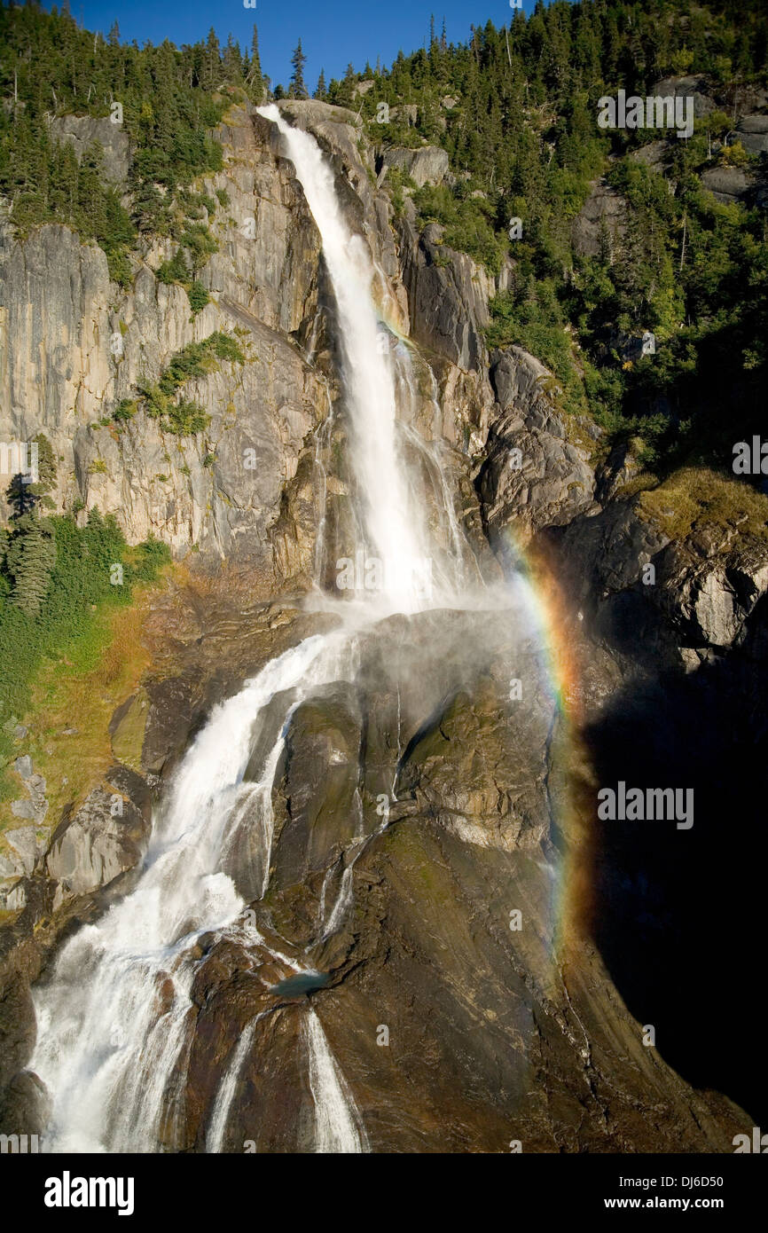 Waterfall Falling From Cliff Creating Rainbow In Taku River Valey ...