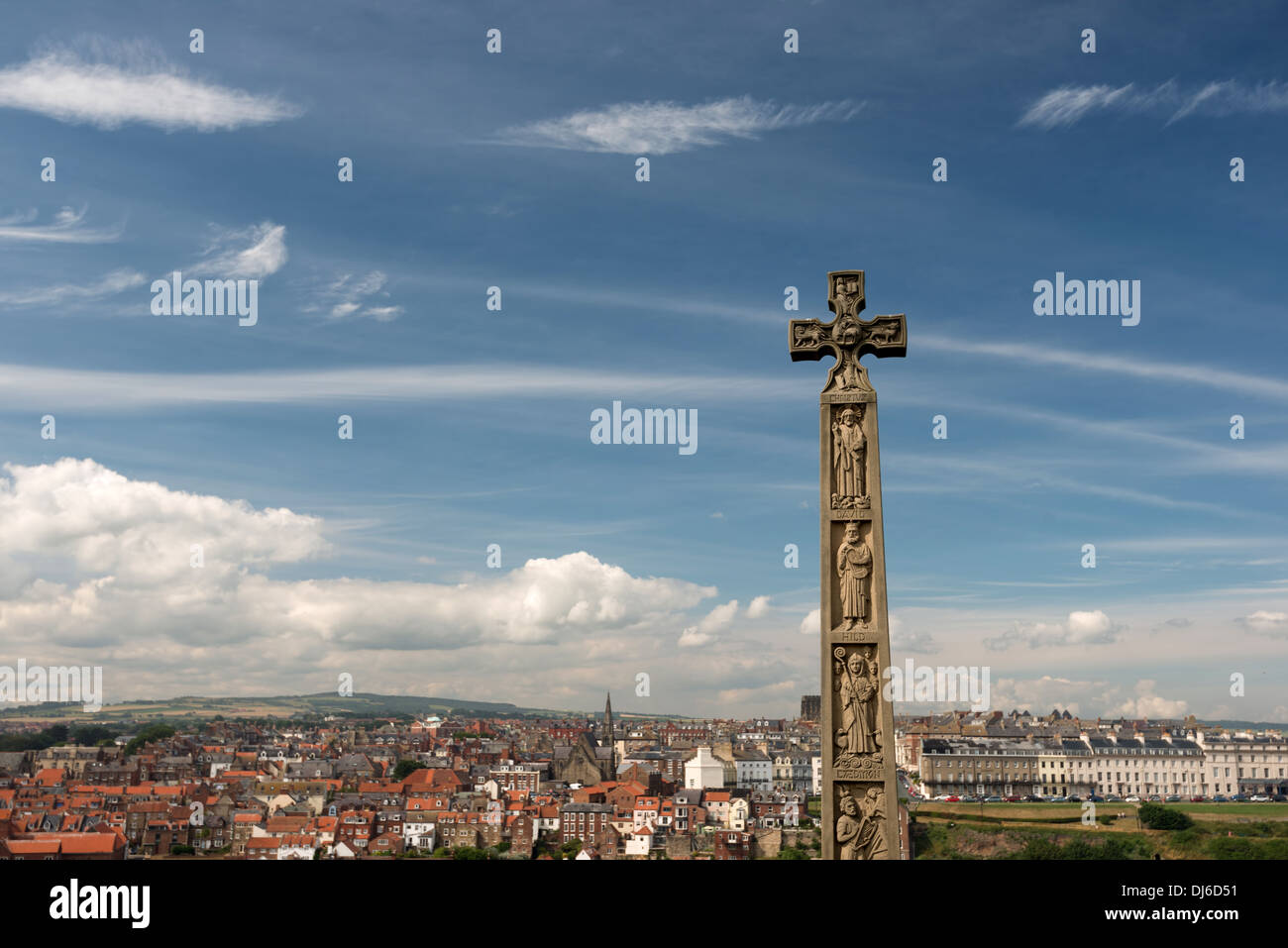 Cross at cemetery, Whitby town on background Stock Photo - Alamy