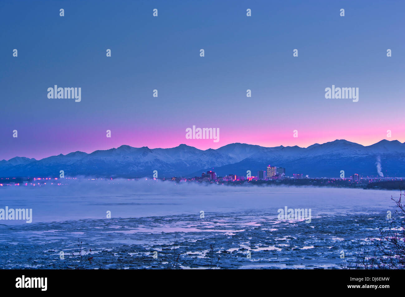 The Anchorage Skyline Before Dawn With Fog Rising From The Waters Of ...