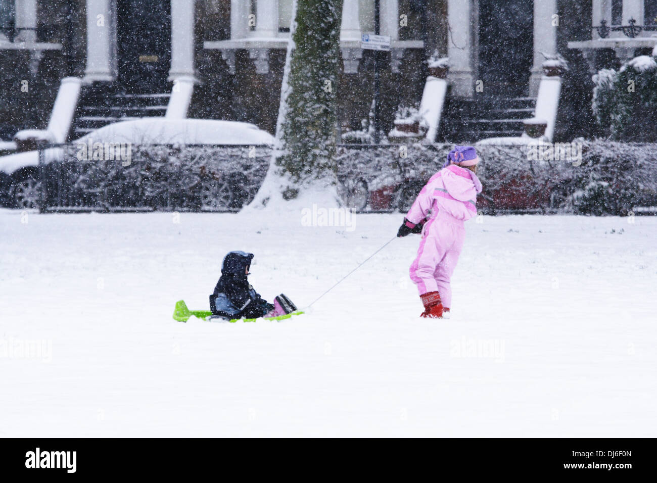 Kids playing on snow hi-res stock photography and images - Alamy