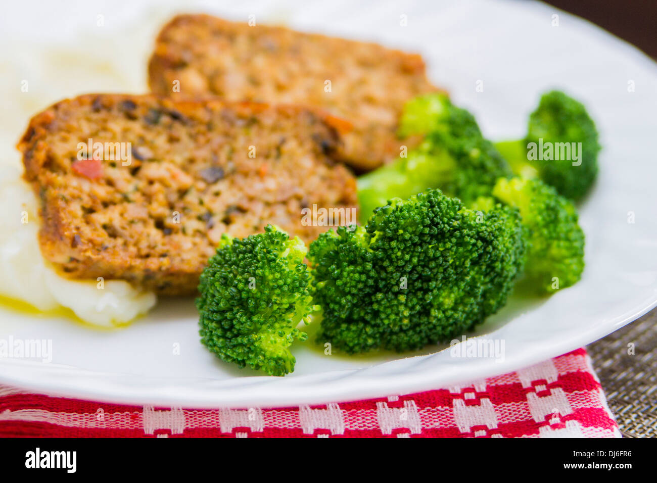 Freshly baked home style pork meatloaf with mashed potatoes and ...