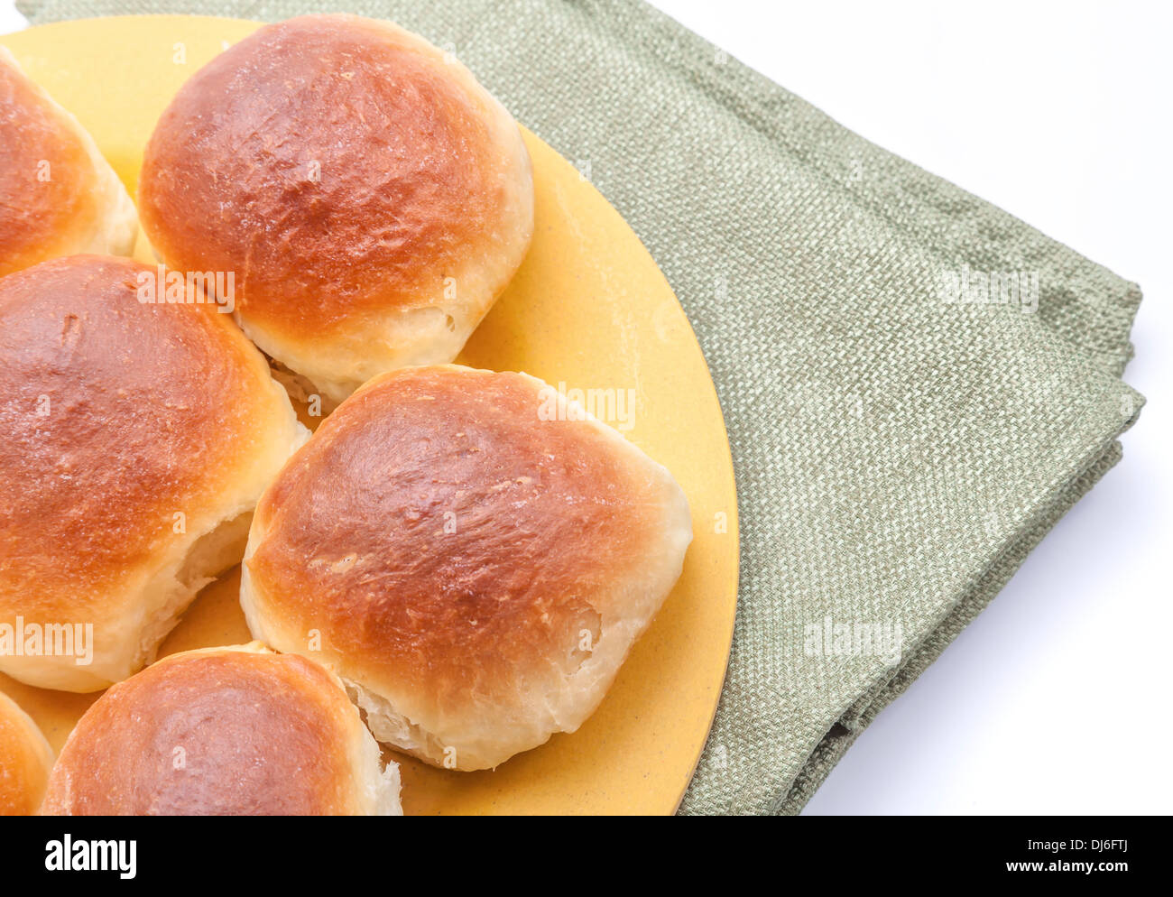 Fresh homemade white bread dinner rolls on a plate with napkin Stock ...