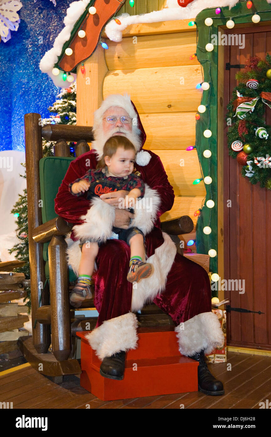 Young Boy Sitting on Santa Claus Lap Stock Photo - Alamy
