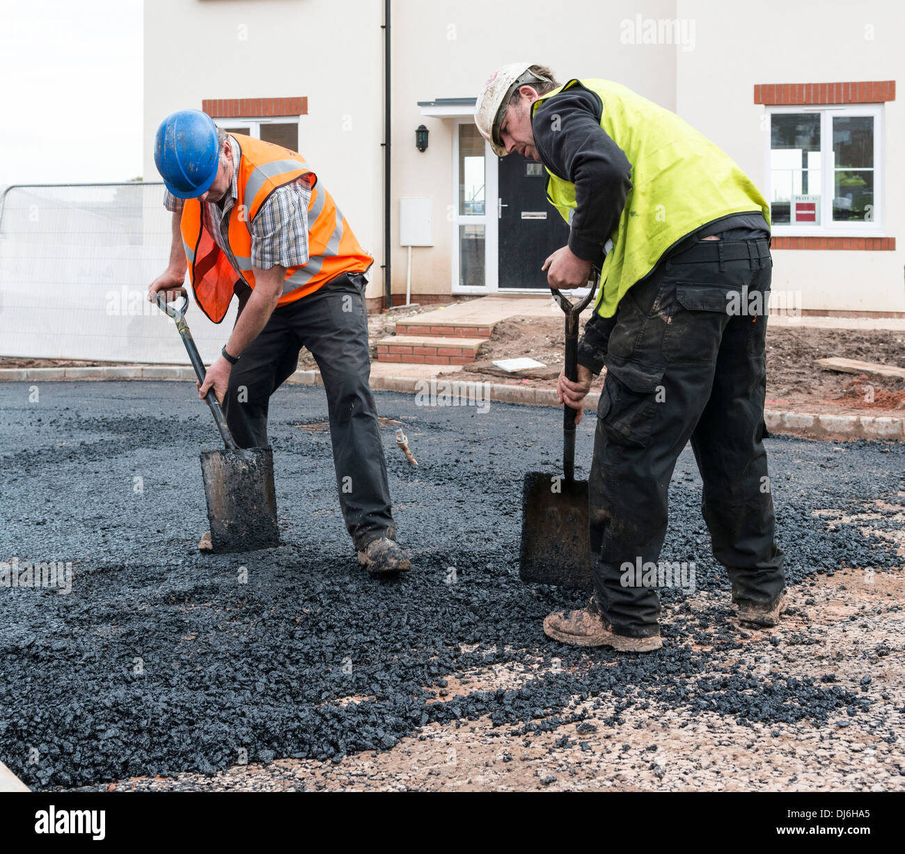 Tarmacadam road surfacing on a residential street Stock Photo - Alamy