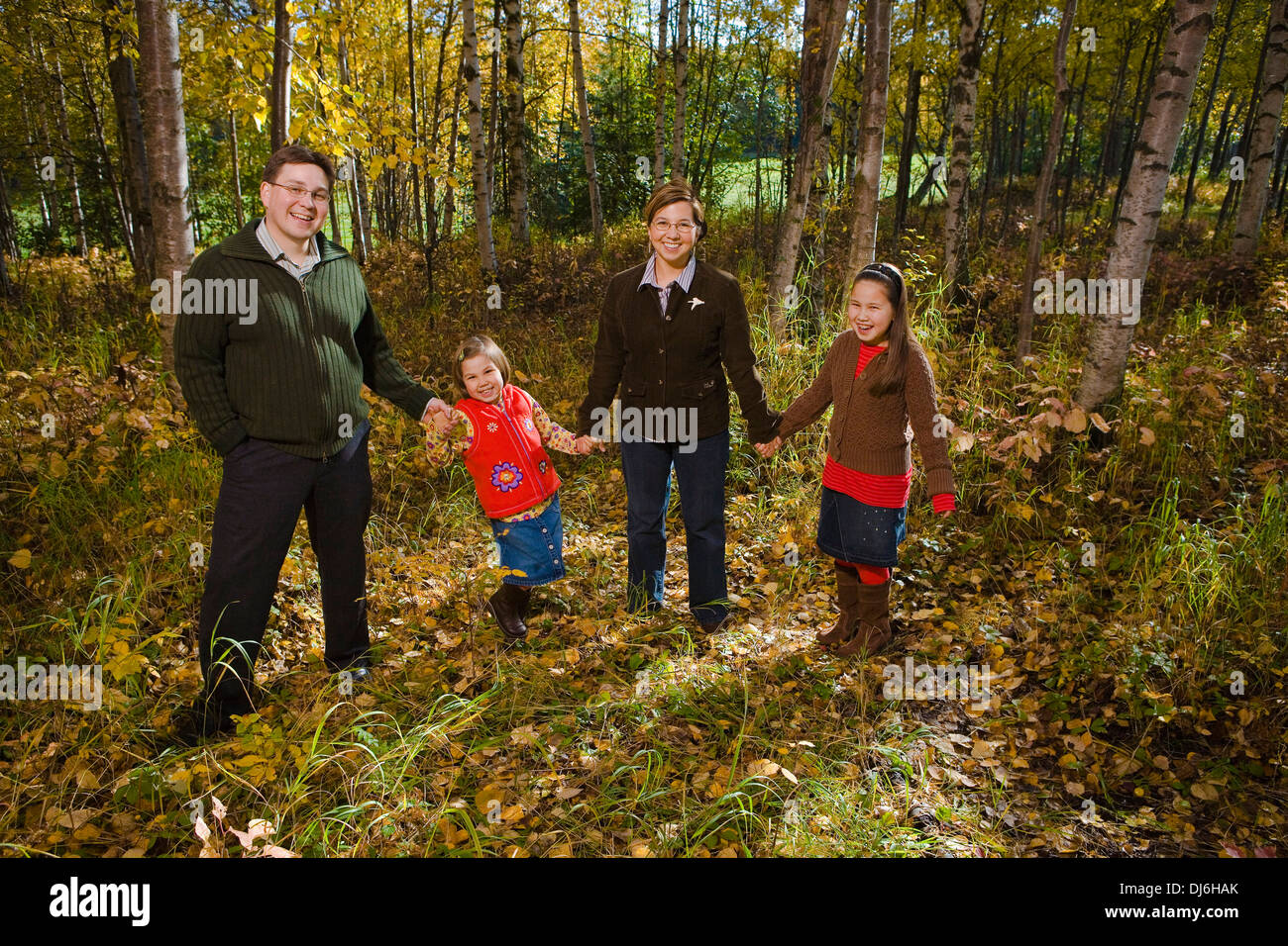 Native Family Walking In Birch Forest During Fall In Southcentral ...