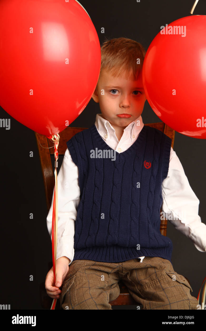 Boy with balloons hi-res stock photography and images - Alamy