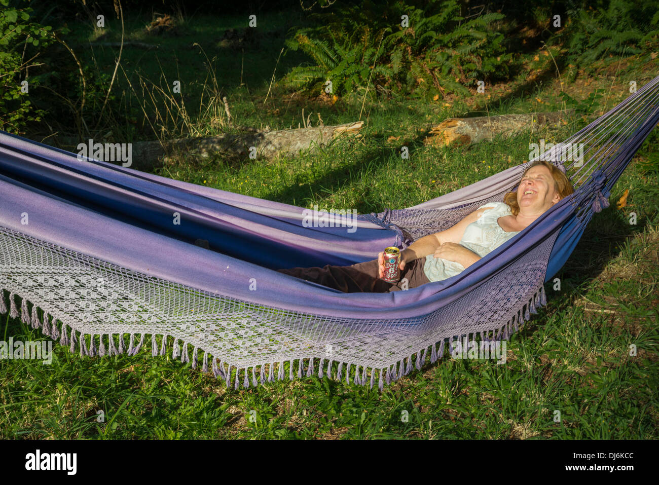 Woman enjoying rest in hammock Stock Photo - Alamy