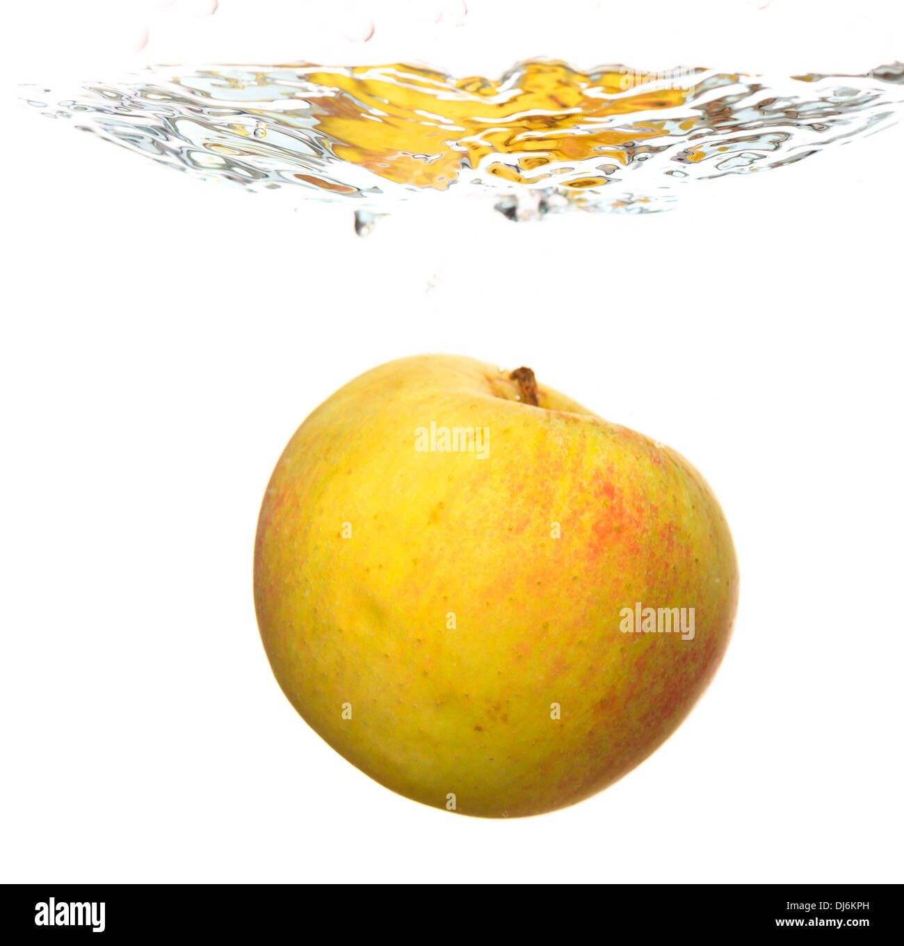 Red yellow apple in the water splash over white background. Healthy ...