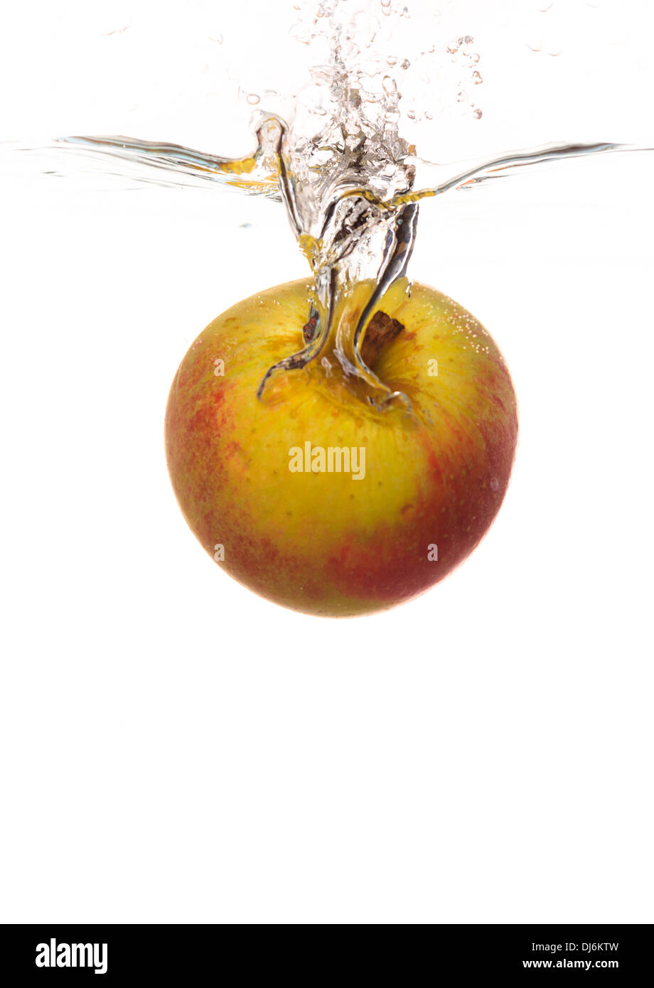Red yellow apple in the water splash over white background. Healthy ...