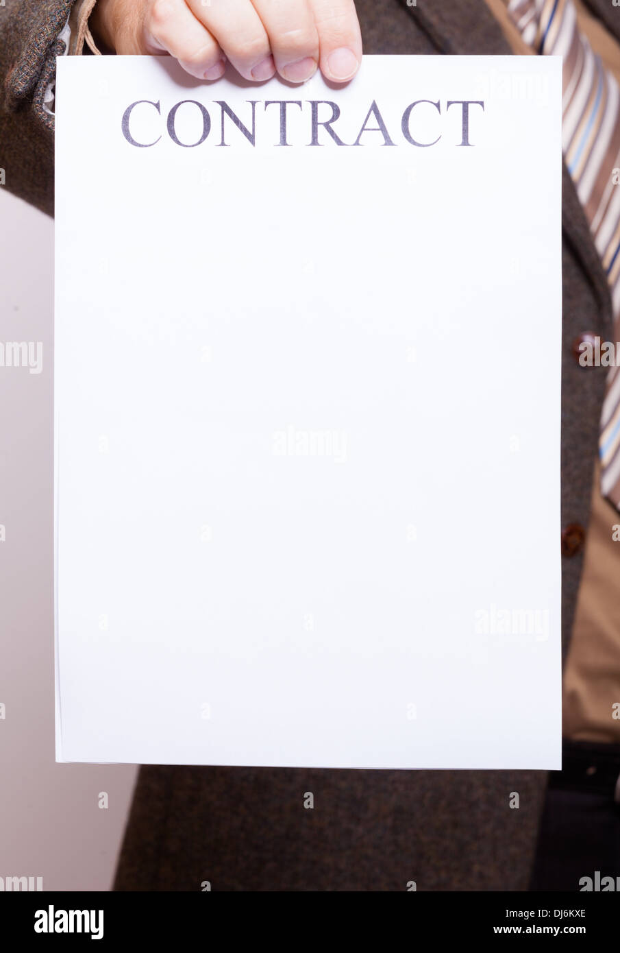 Business concept. Businessman holding blank empty paper sheet with sign ...
