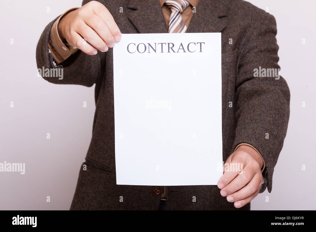 Business concept. Businessman holding blank empty paper sheet with sign ...