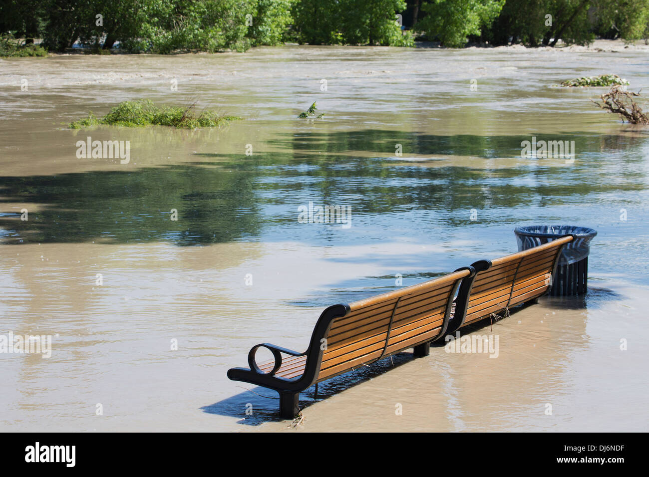 A Park Bench Sits In High Water After Flooding; Calgary, Alberta ...