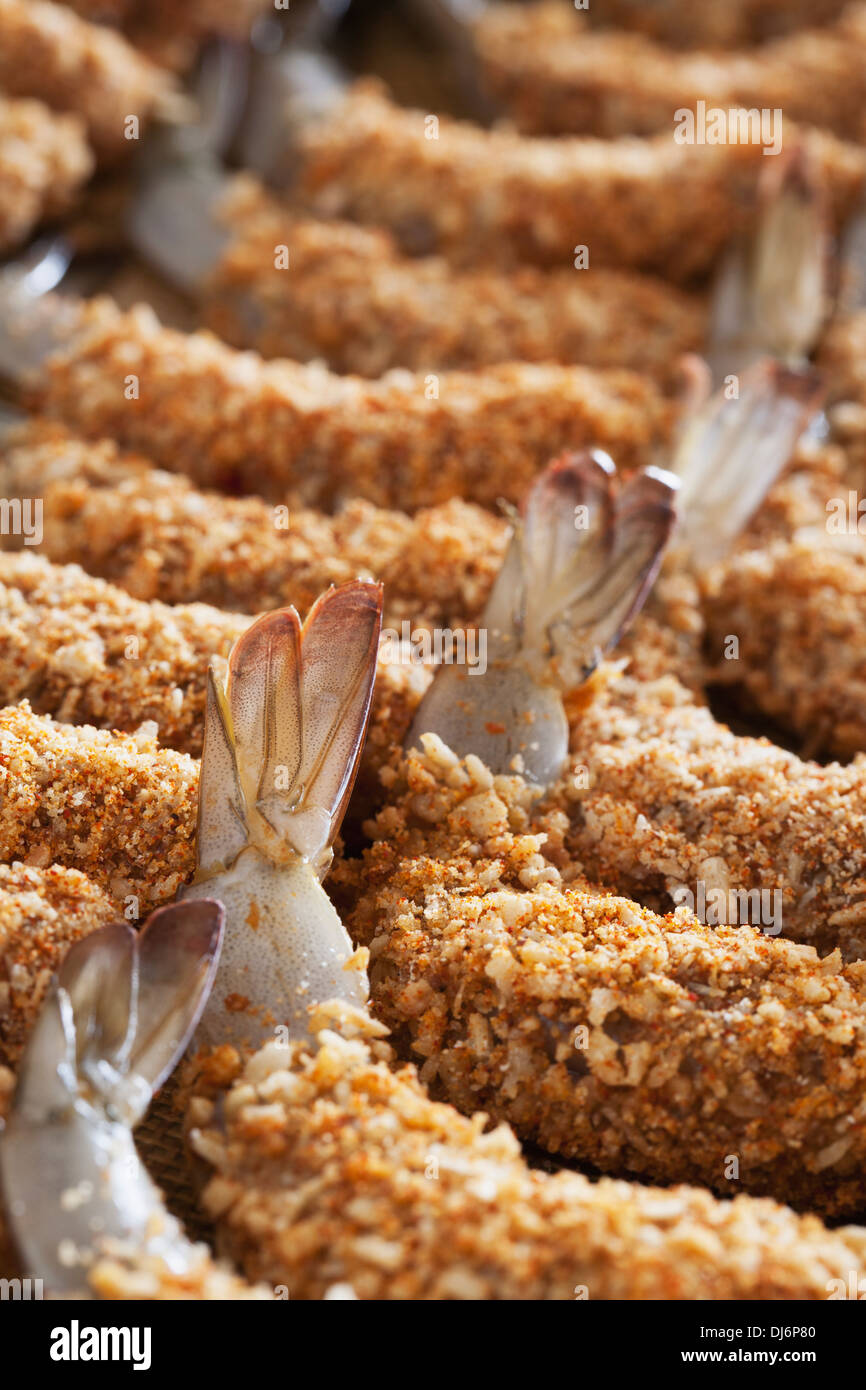 Close Up Of Breaded Shrimp In A Row On A Cooking Sheet With Tails ...