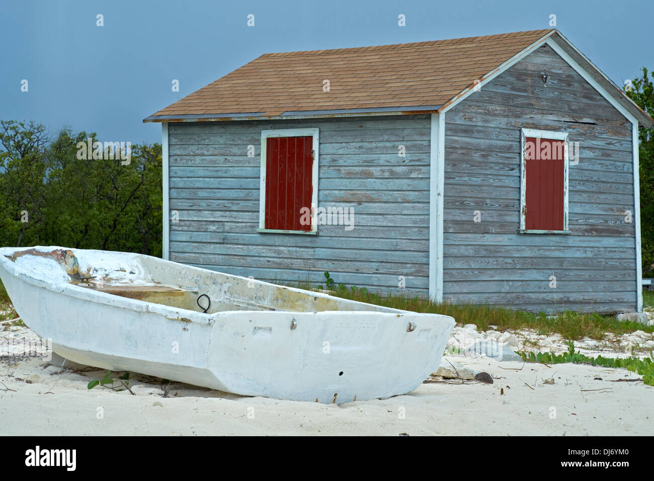 Beach Shack with abandoned boat Stock Photo - Alamy