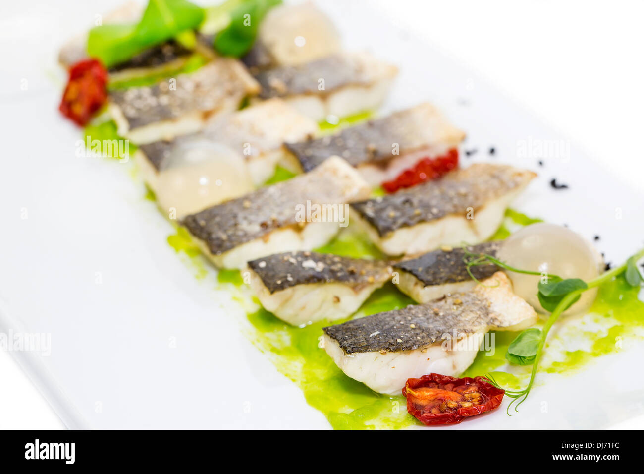Baked black cod fish on a white background in the restaurant Stock ...