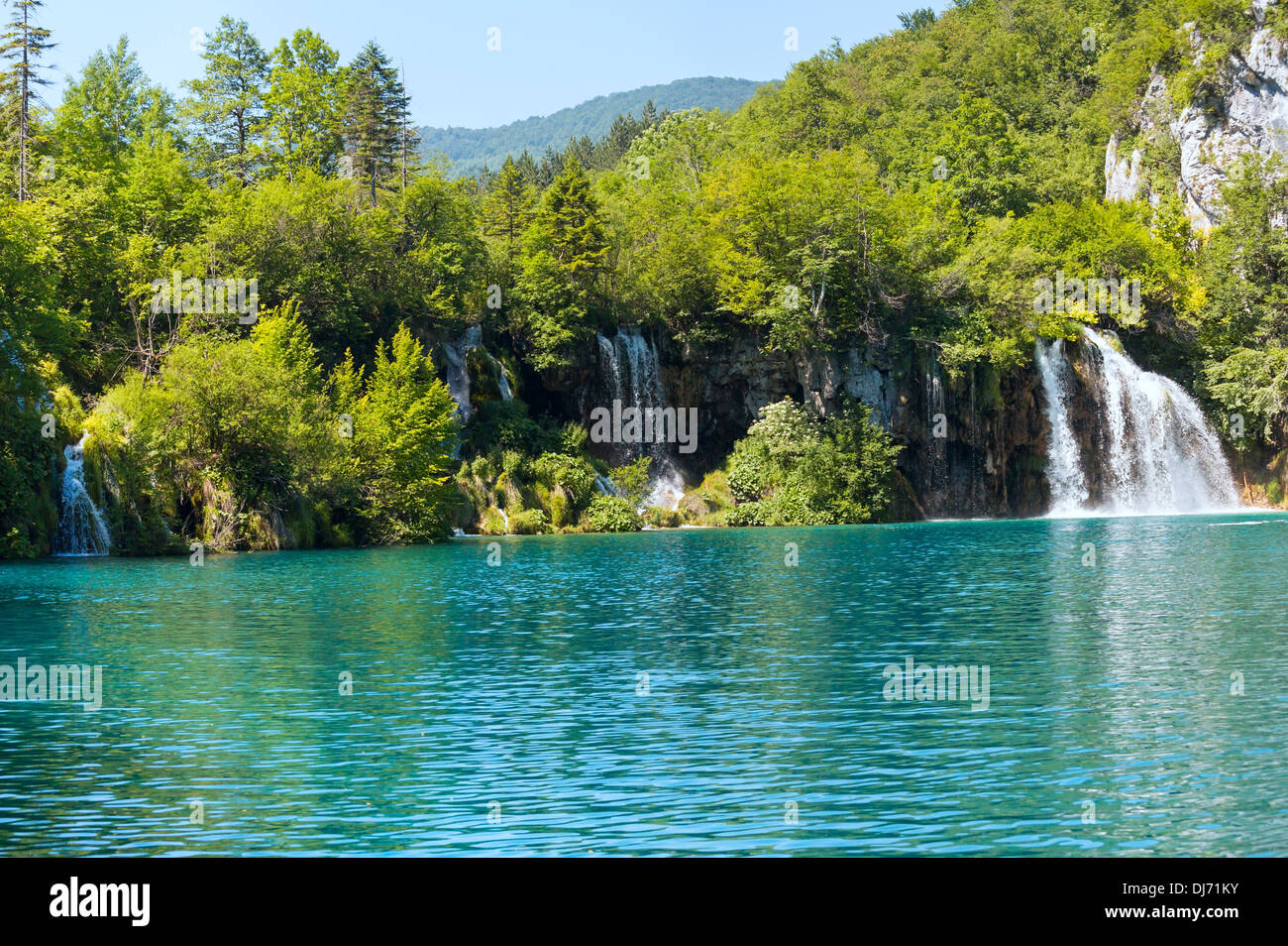 Beautiful waterfall and blue limpid lake in Plitvice Lakes National ...