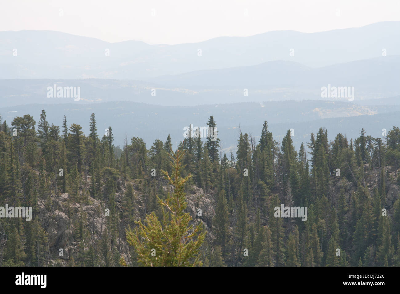 View of Colorado Rocky Mountains with smoky haze in distance due to ...