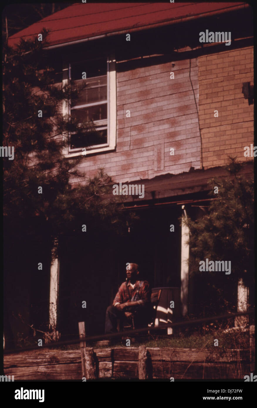 OTIS SAUNDERS, IN HIS LATE 80'S, SUNS IN FRONT OF HIS HOME IN FIRECO ...