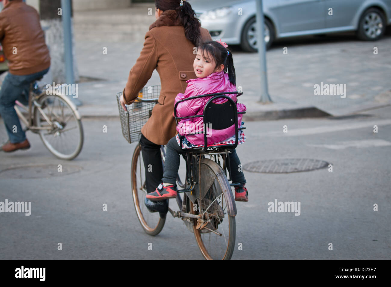Girl riding bike china hi-res stock photography and images - Alamy