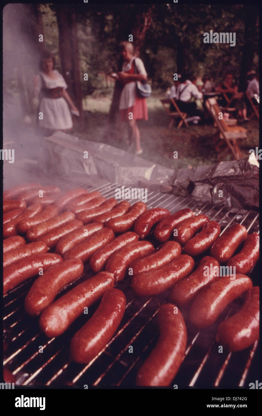 WURST COOK ON AN OUTDOOR CHARCOAL GRILL AT THE FIFTH ANNUAL OKTOBERFEST ...