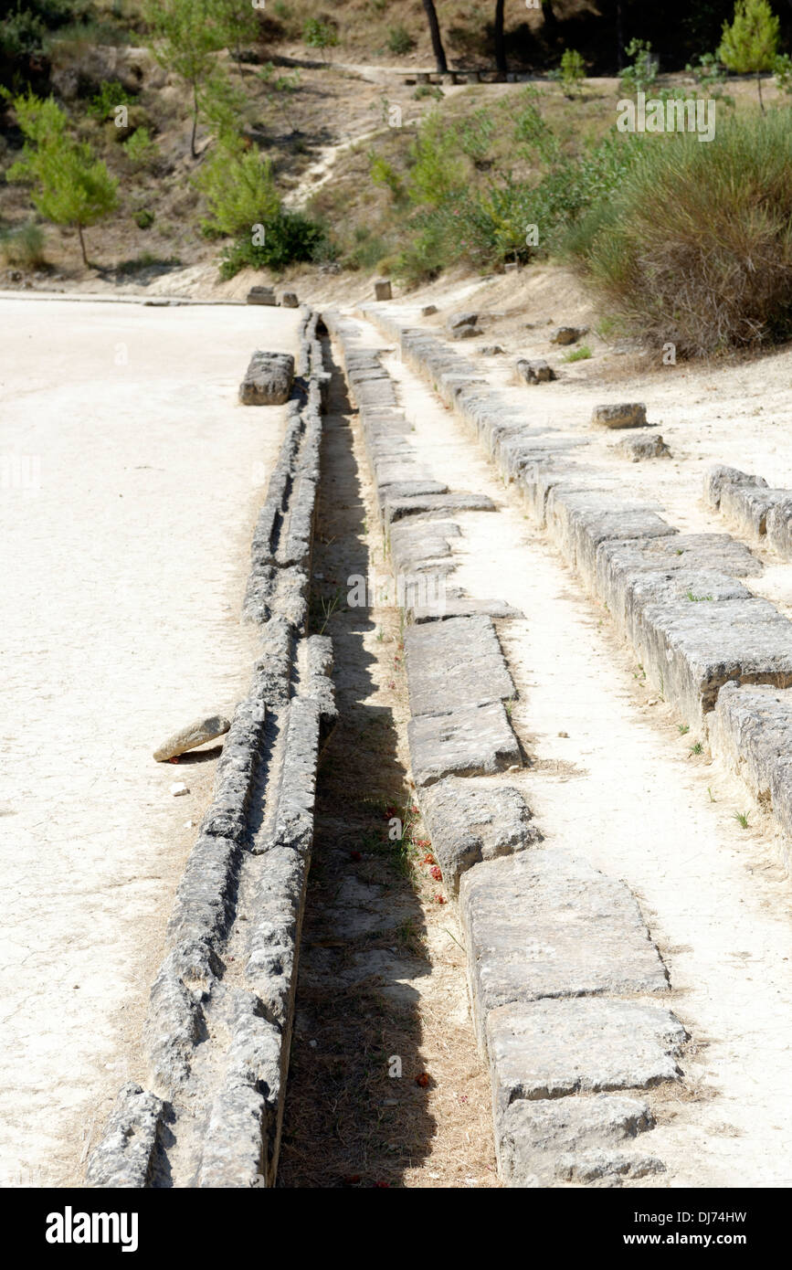Fresh water stone channel along the side of the stadium running track ...