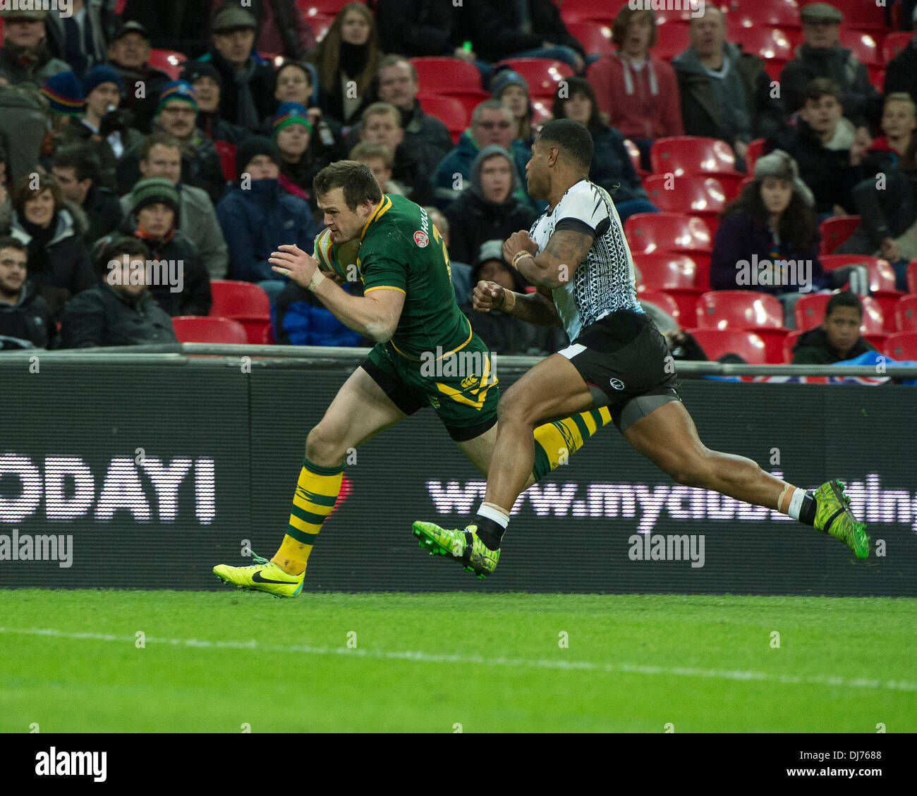 London, UK. 23rd Nov, 2013. Australia's Brett Morris [2] on his way to ...