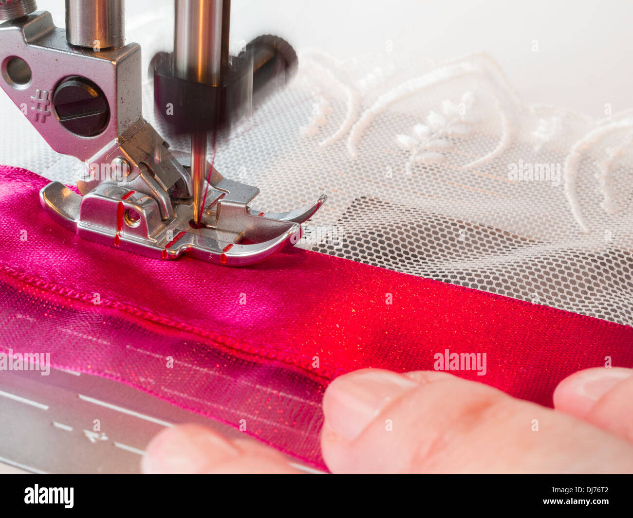 Machine Sewing Pink Ribbons and Lace Stock Photo - Alamy